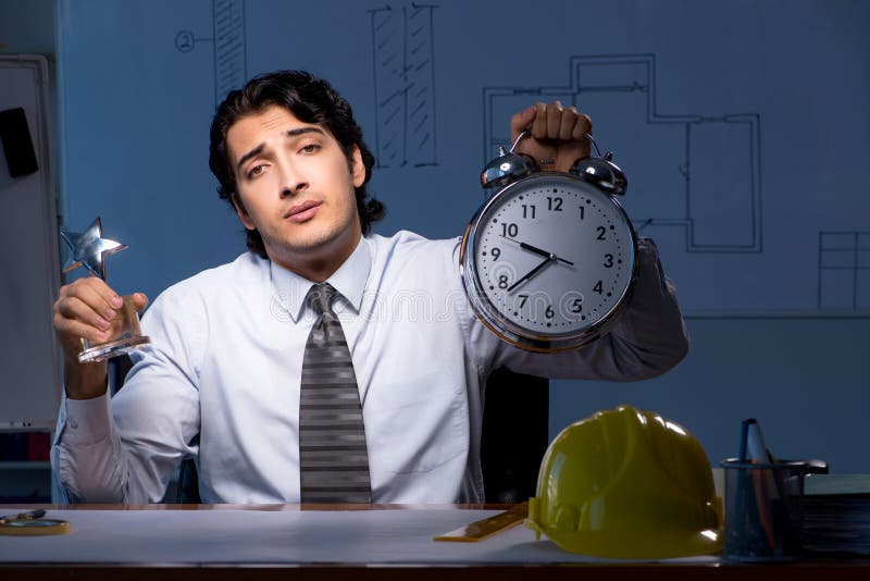 The Young Construction Architect Working on Project at Night Stock ...