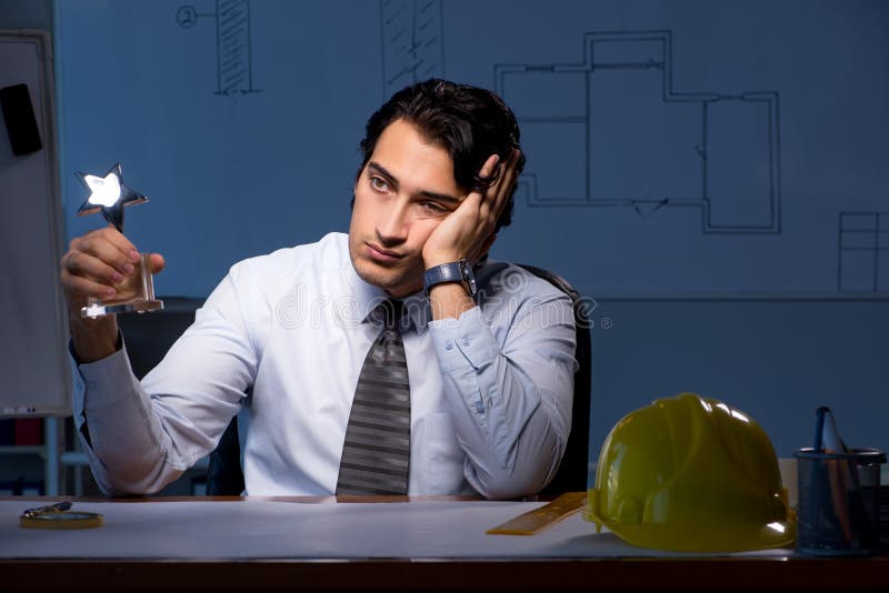 The Young Construction Architect Working on Project at Night Stock ...