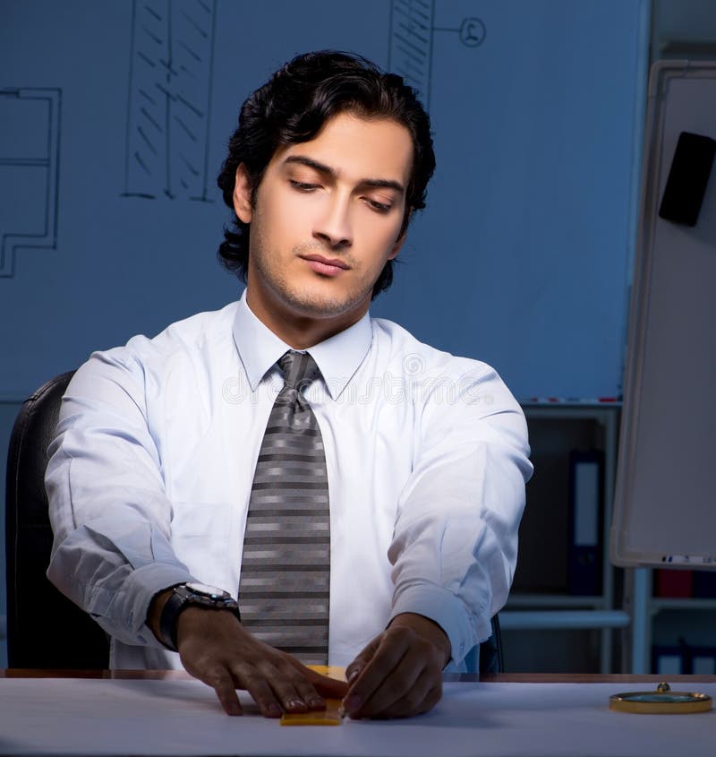 Young Construction Architect Working on Project at Night Stock Photo ...