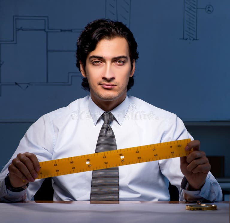 Young Construction Architect Working on Project at Night Stock Image ...