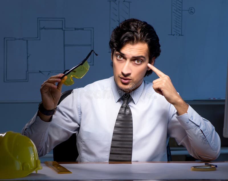 Young Construction Architect Working on Project at Night Stock Image ...