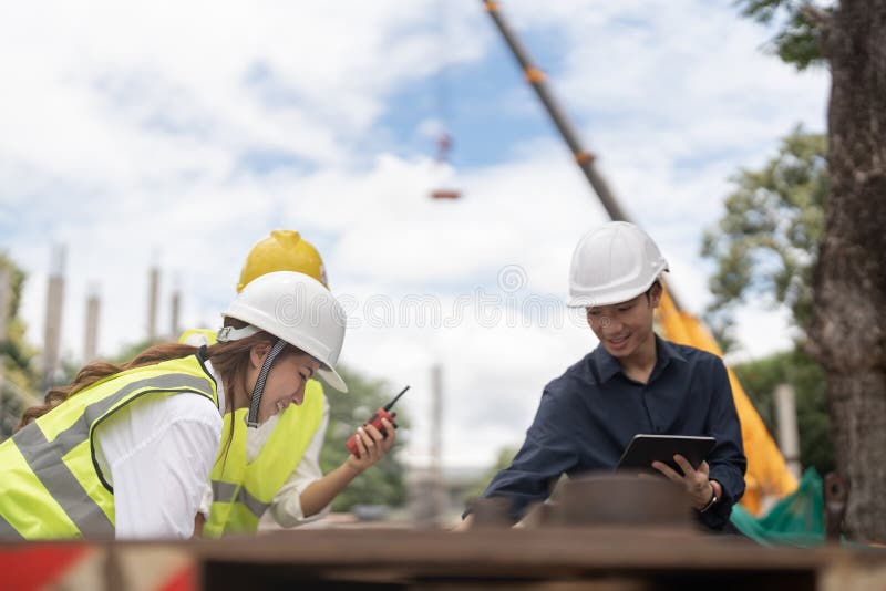 Young Construction Engineer People Working Together at the Building ...