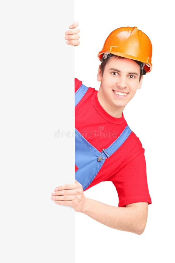Young Construction Worker with Helmet Posing Behind a Panel Stock Photo ...