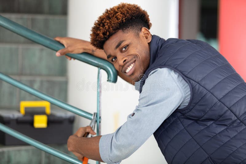 Young Construction Worker Repairing Stairs Stock Image - Image of tool ...