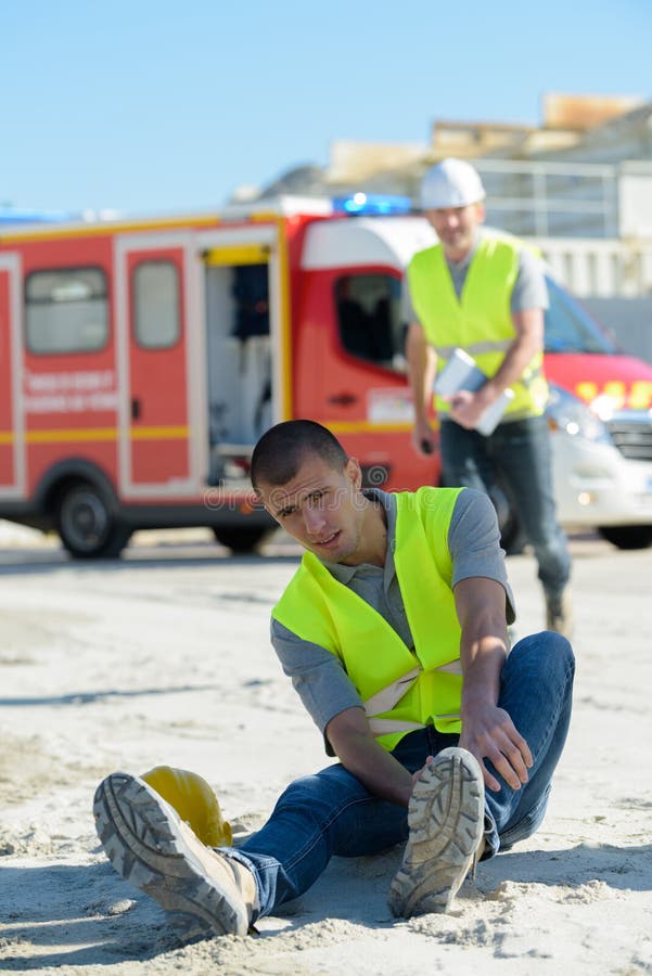 Young Construction Worker Suffering Leg Injury on Site Stock Image ...