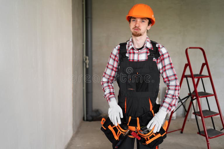 Young Construction Worker with Tool Belt Showing Speechless Expression ...
