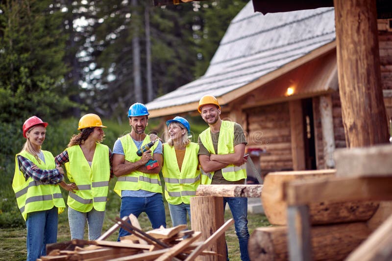 Young Construction Workers Team Building Together Stock Photo - Image ...