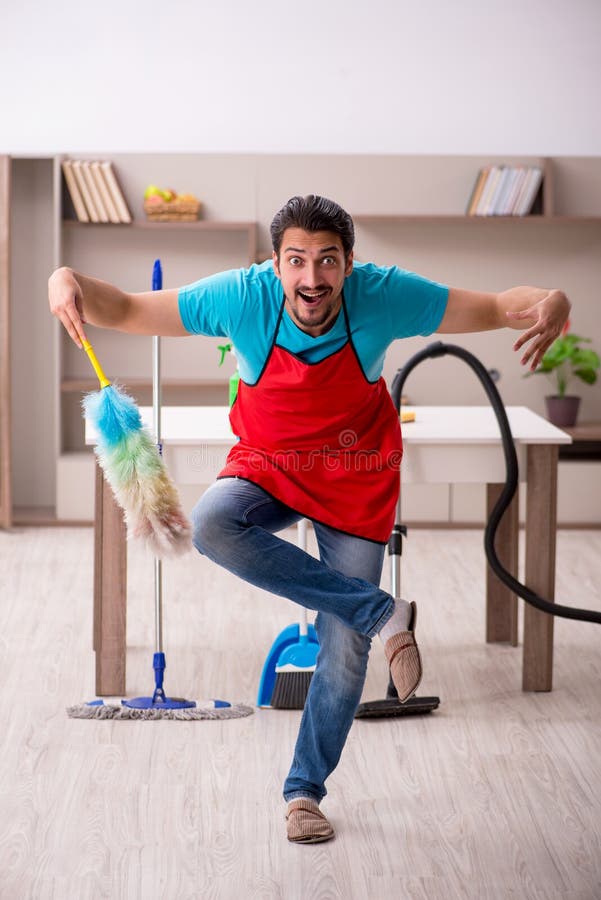 Young Male Contractor Cleaning the House Stock Photo - Image of feather ...