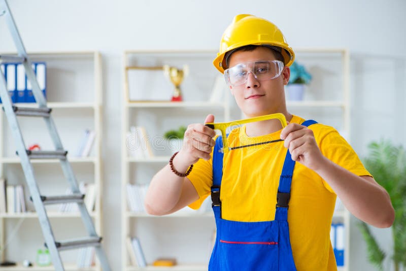 The Young Contractor Doing Repair Works at Office Stock Image - Image ...
