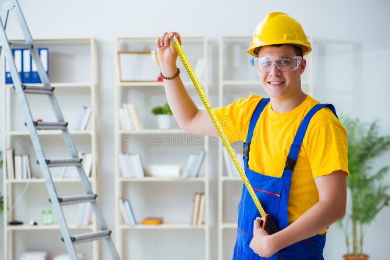 The Young Contractor Doing Repair Works at Office Stock Image - Image ...