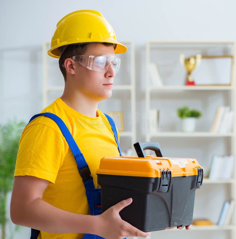 Young Contractor Doing Repair Works at Office Stock Image - Image of ...
