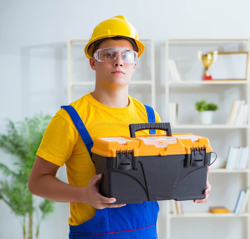 Young Contractor Doing Repair Works at Office Stock Photo - Image of ...