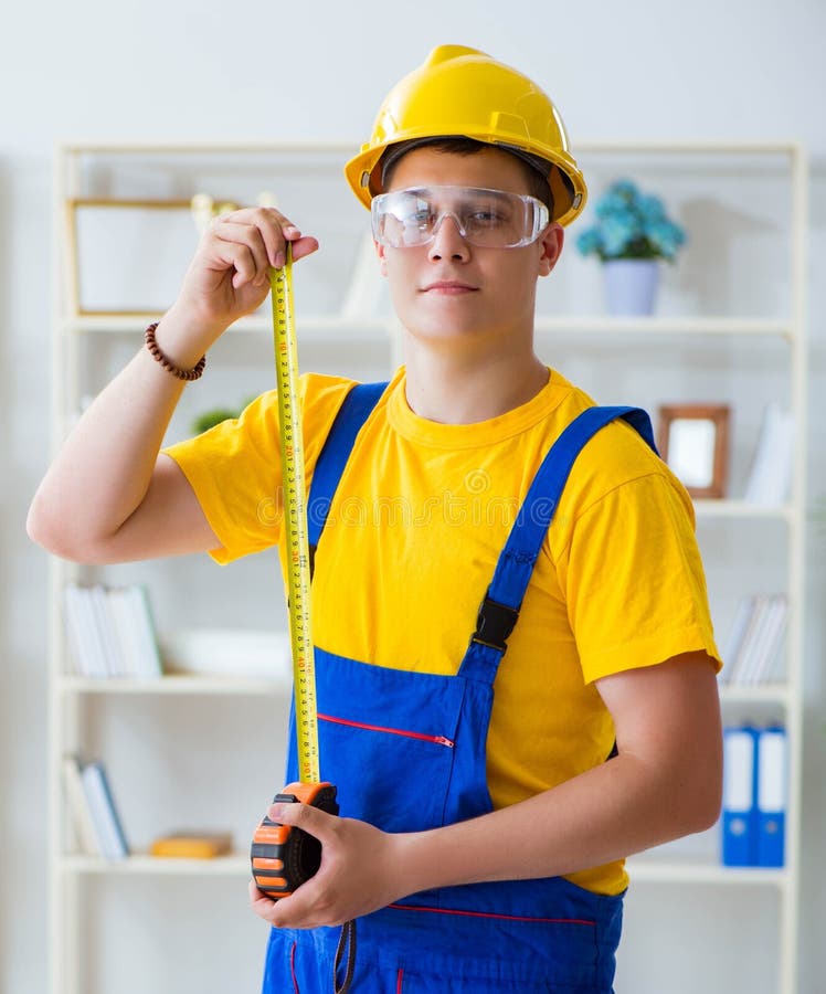 Young Contractor Doing Repair Works at Office Stock Photo - Image of ...