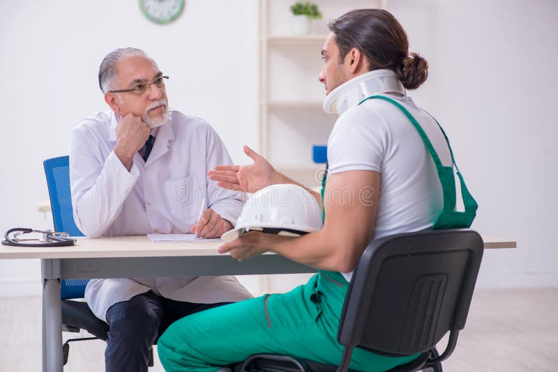 Young Male Contractor Visiting Old Doctor Stock Photo - Image of ...