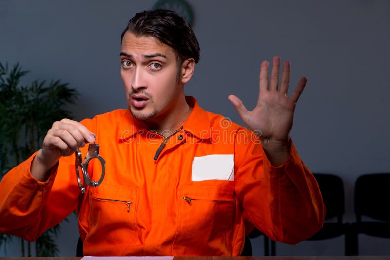 Young Convict Man Sitting in Dark Room Stock Image - Image of cuff ...