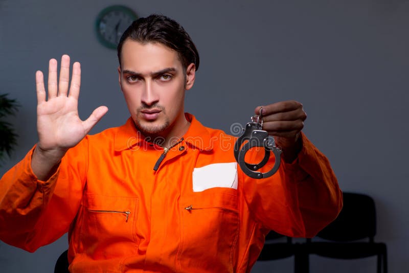 Young Convict Man Sitting in Dark Room Stock Photo - Image of detaining ...