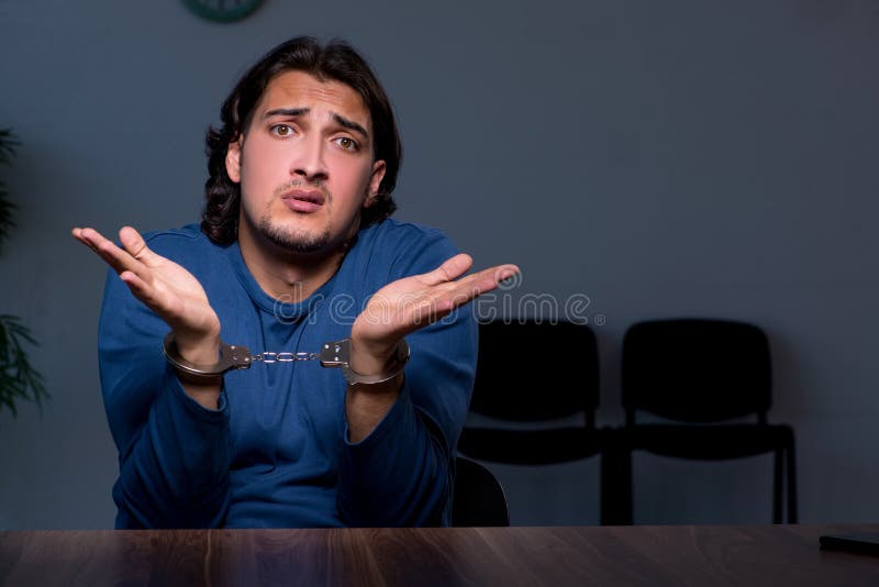 Young Convict Man Sitting in Dark Room Stock Image - Image of convict ...