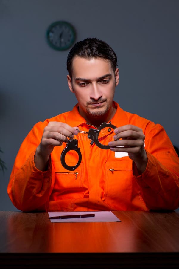 Young Convict Man Sitting in Dark Room Stock Photo - Image of ...