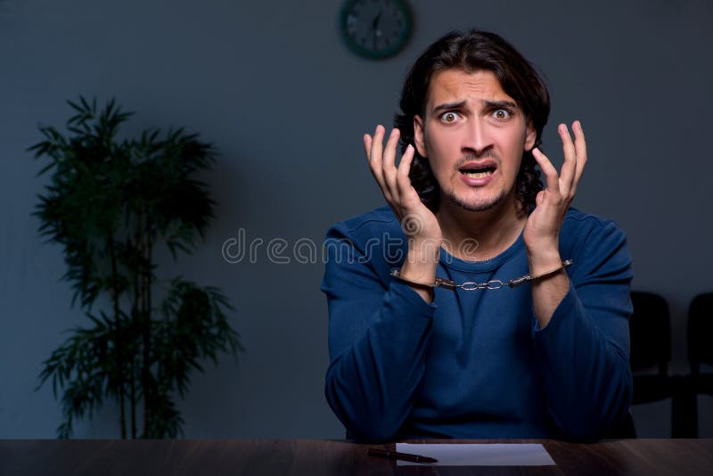 Young Convict Man Sitting in Dark Room Stock Image - Image of cuffs ...