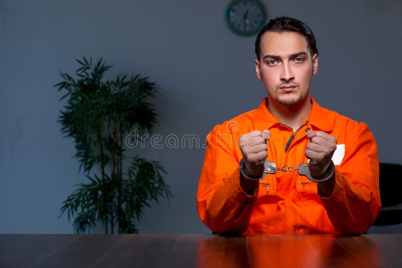 Young Convict Man Sitting in Dark Room Stock Photo - Image of jail ...