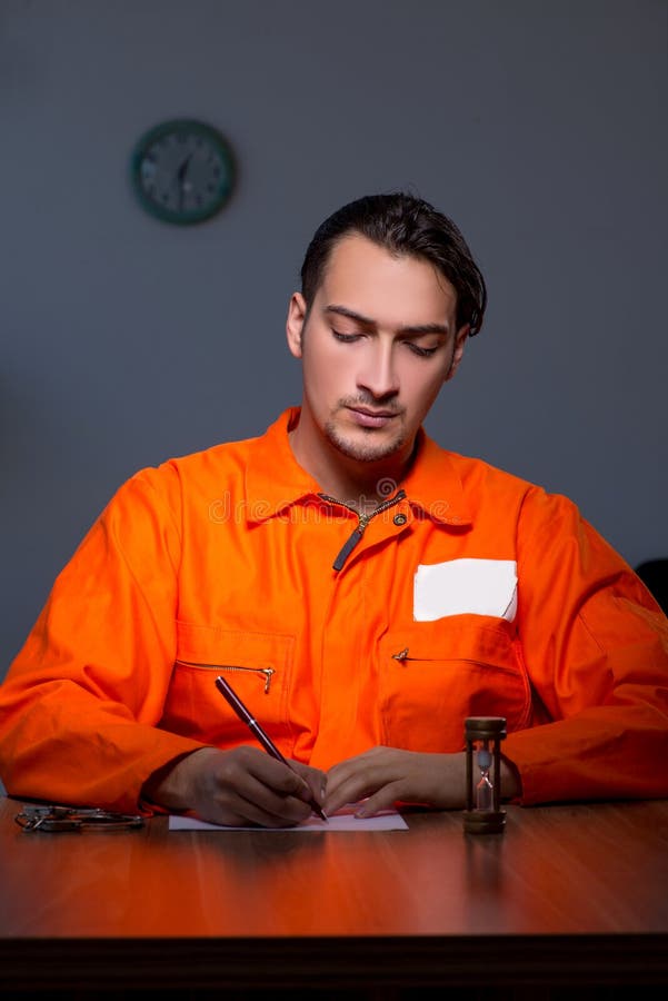 Young Convict Man Sitting in Dark Room Stock Photo - Image of detention ...