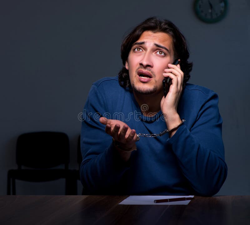 Young Convict Man Sitting in Dark Room Stock Photo - Image of detaining ...