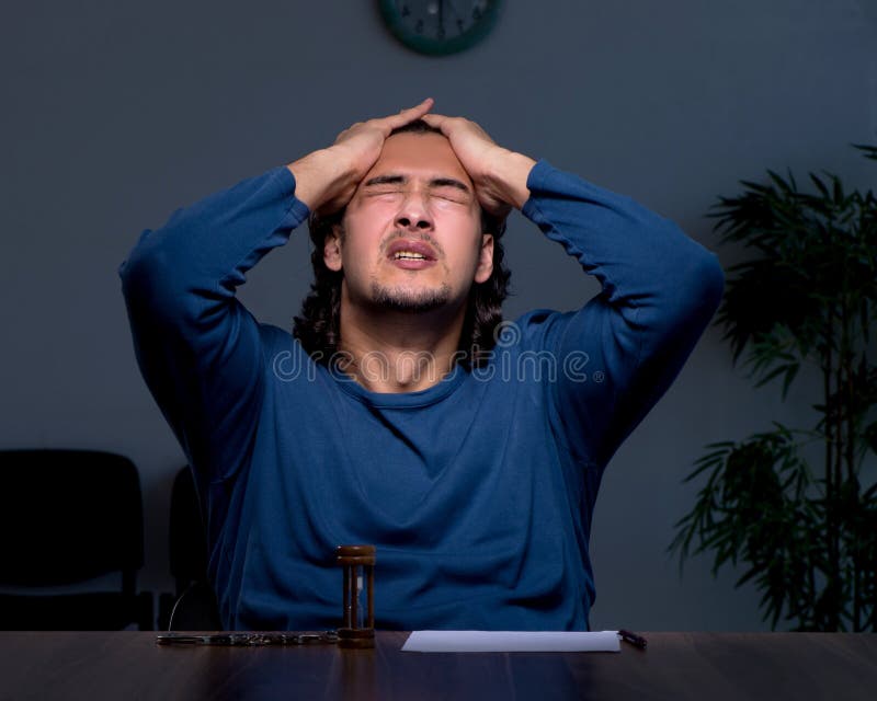 Young Convict Man Sitting in Dark Room Stock Photo - Image of lock ...