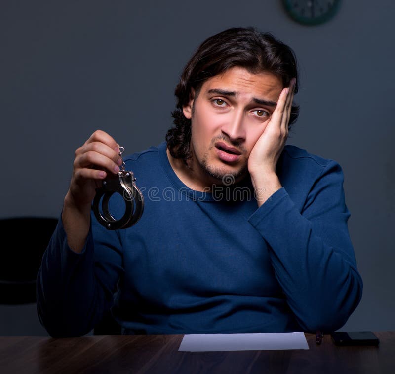 Young Convict Man Sitting in Dark Room Stock Photo - Image of jail ...