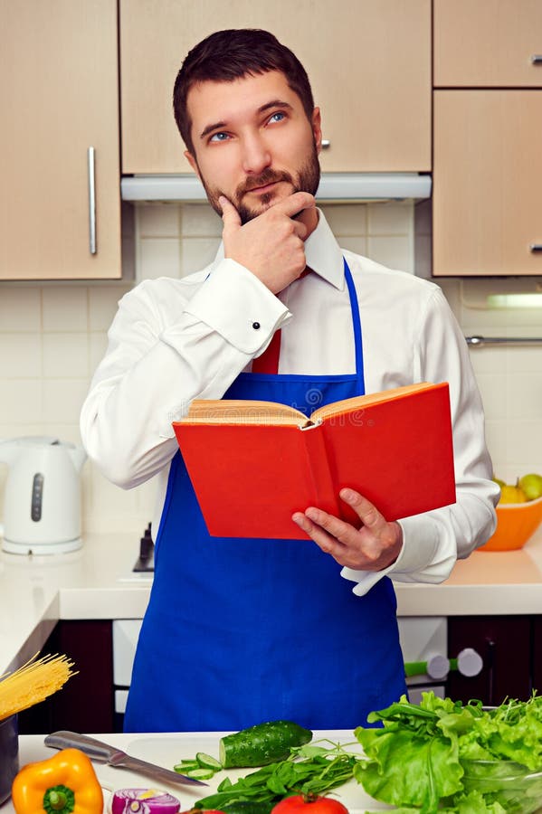 Young Cook with Cookbook Thinking about Recipe Stock Image - Image of ...