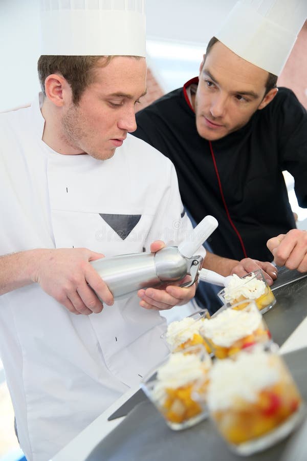 Young Cook with Cooking Chef Preparing Dessert Stock Image - Image of ...