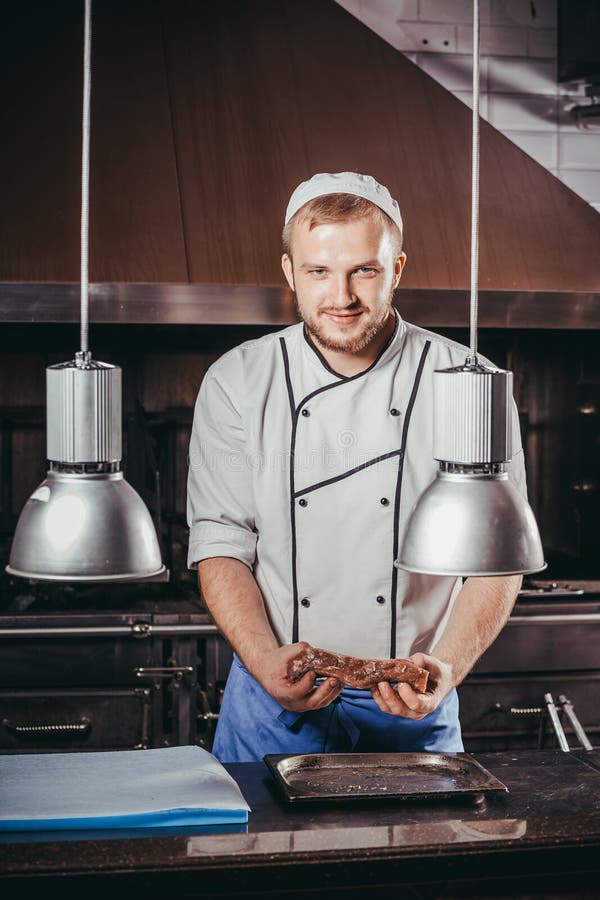 Young Cook in Restaurant Kitchen Stock Image - Image of board, hands ...