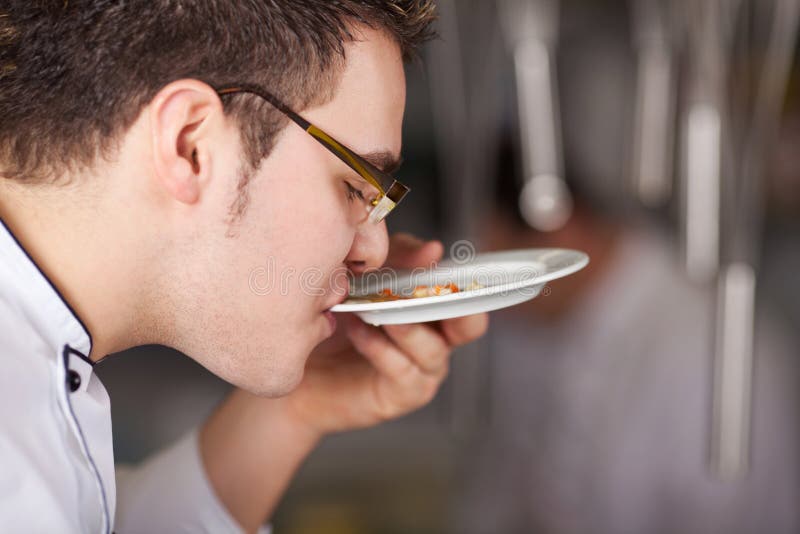 Young cook tasting soup stock photo. Image of industrial - 31353174
