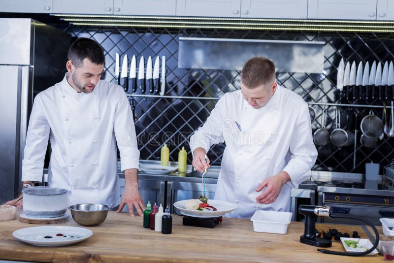 Young Cooks Working in the Kitchen Together Stock Photo - Image of cook ...