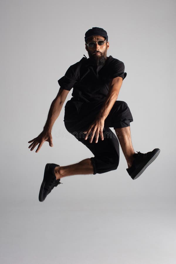 Hip Hop Dancer Moving and Jumping in Photostudio Stock Photo - Image of ...