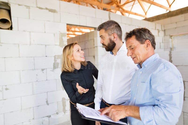 Architects and Civil Engineer at the Construction Site. Stock Image ...