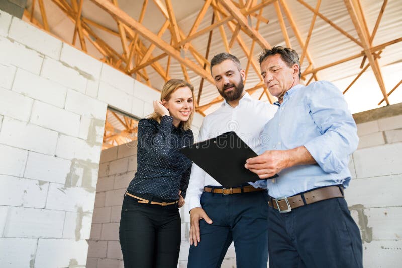 Architects and Civil Engineer at the Construction Site. Stock Image ...