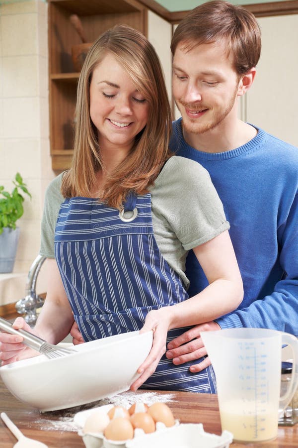Young Couple Baking In Kitchen Together Stock Photo - Image of bowl ...