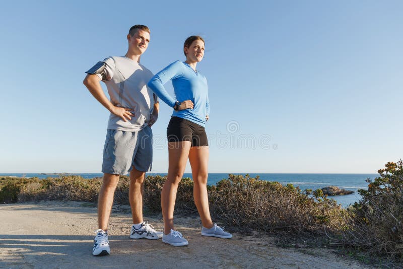 Young Couple on Beach Training Together Stock Photo - Image of people ...