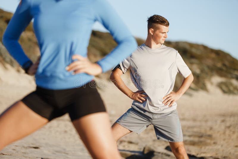 Young Couple on Beach Training Together Stock Image - Image of partners ...
