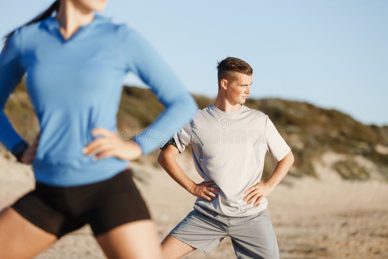 Young Couple on Beach Training Together Stock Image - Image of class ...