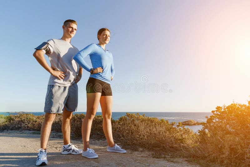 Young Couple on Beach Training Together Stock Image - Image of ...