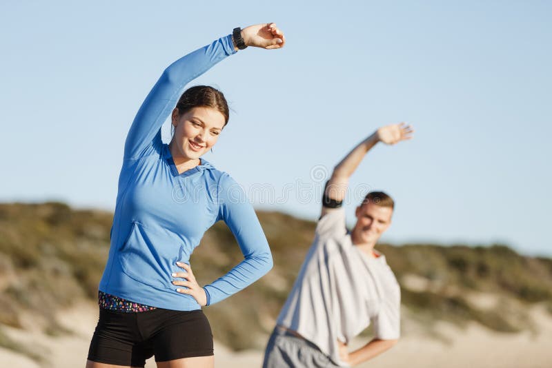 Young Couple on Beach Training Together Stock Image - Image of ...