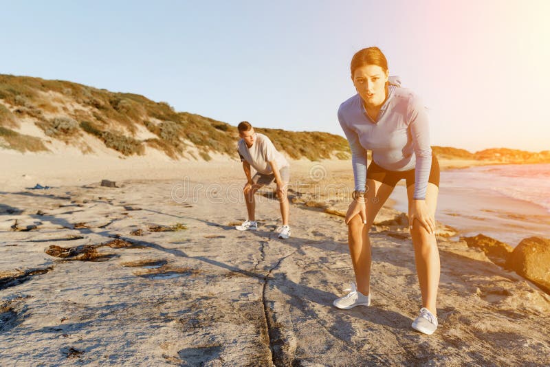 Young Couple on Beach Training Together Stock Image - Image of athlete ...