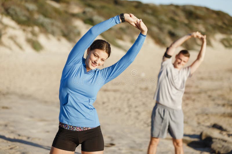 Young Couple on Beach Training Together Stock Image - Image of slim ...