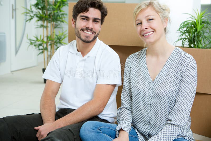 Young couple and boxes stock photo. Image of couple - 217133986