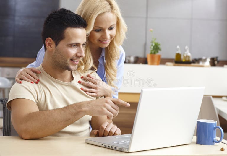 Young Couple Browsing Internet at Home Stock Photo - Image of fondling ...