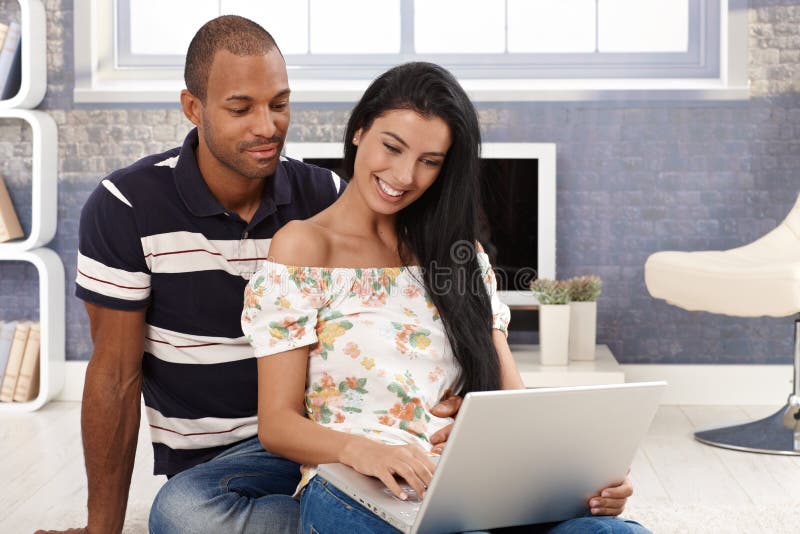Young Couple Browsing Internet Together Smiling Stock Image - Image of ...
