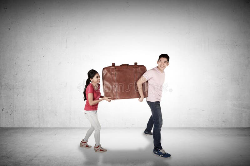 Young Couple Carry Big Baggage Stock Photo - Image of traveler, luggage ...