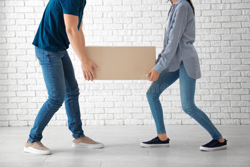 Young Couple Carrying Big Moving Box at New Home Stock Image - Image of ...