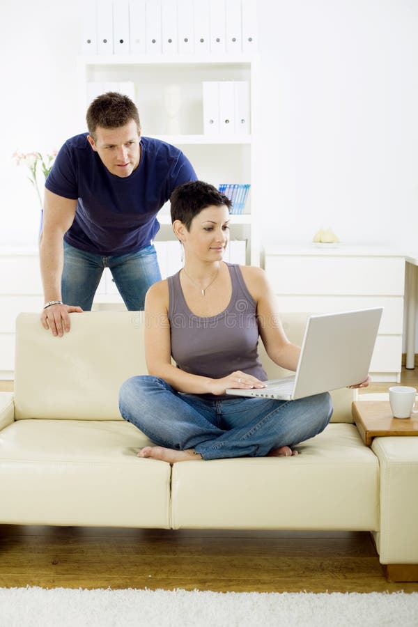 Young couple with computer stock photo. Image of employment - 7975482